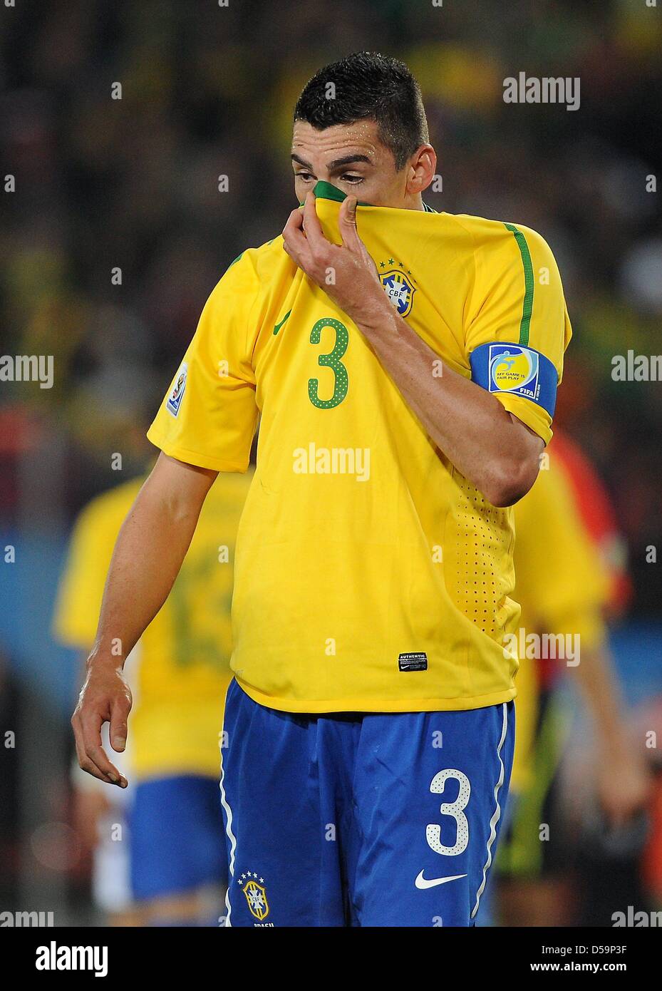 Brazil's Lucio pulls his jersey over his nose during the 2010 FIFA ...