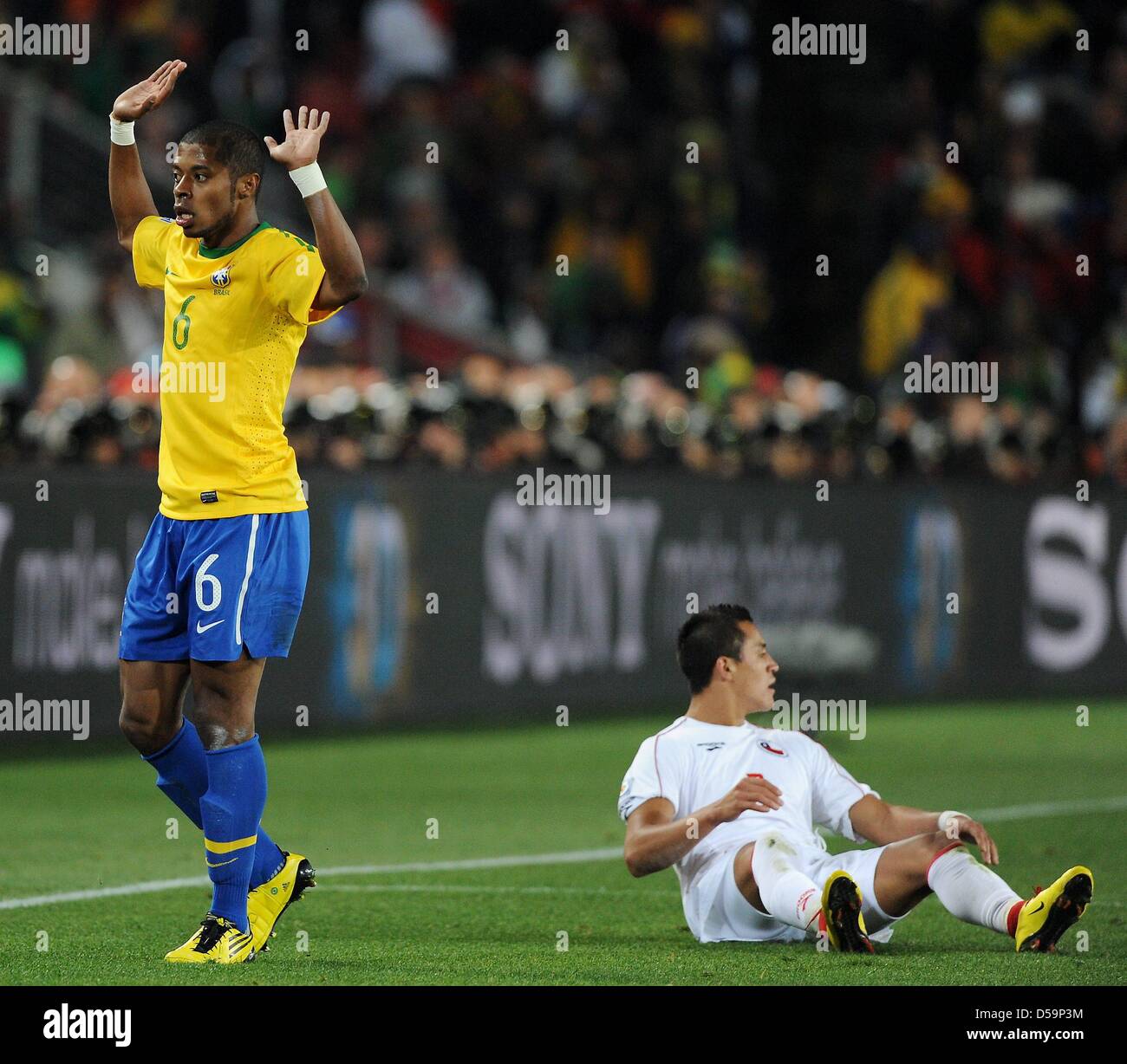 Brazil's Michel Bastos reacts as Chile's Alexis Sanchez sits on the ...
