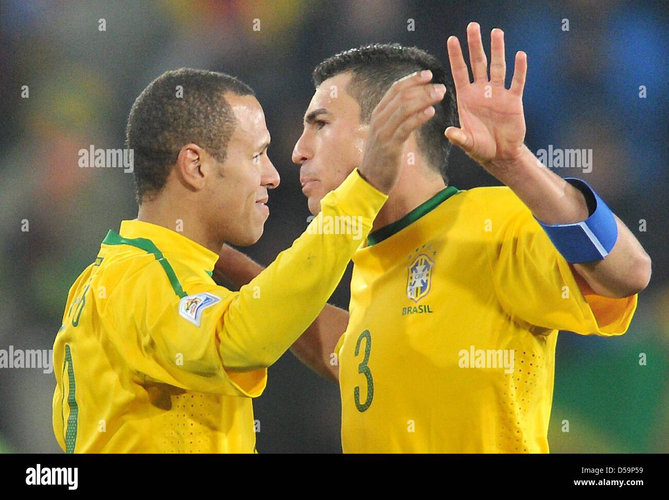 Luis Fabiano (L) and Lucio of Brazil celebrate after the final whistle ...