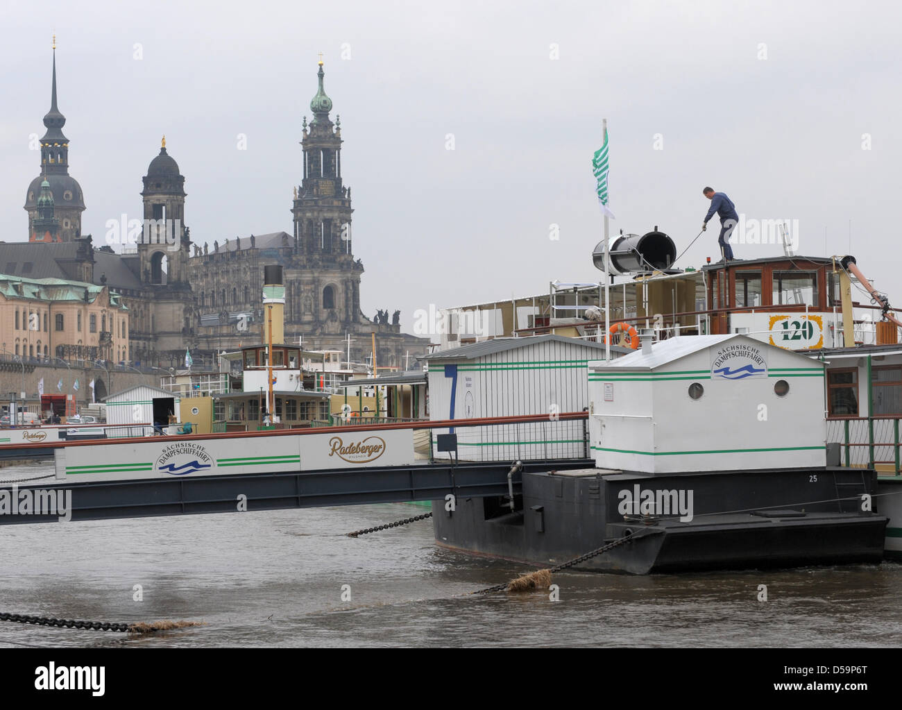 A worker is busy on the smoke stack of the 'Pillnitz', an 1896 built ...