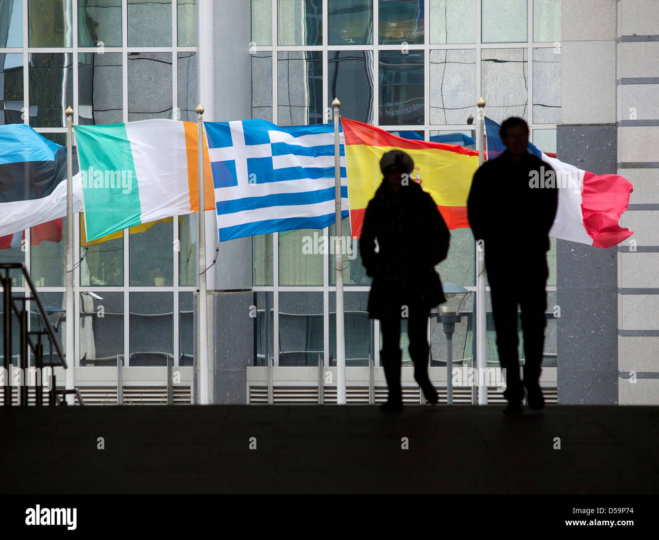 Waving flags of problem countries in front of the European Parliament ...