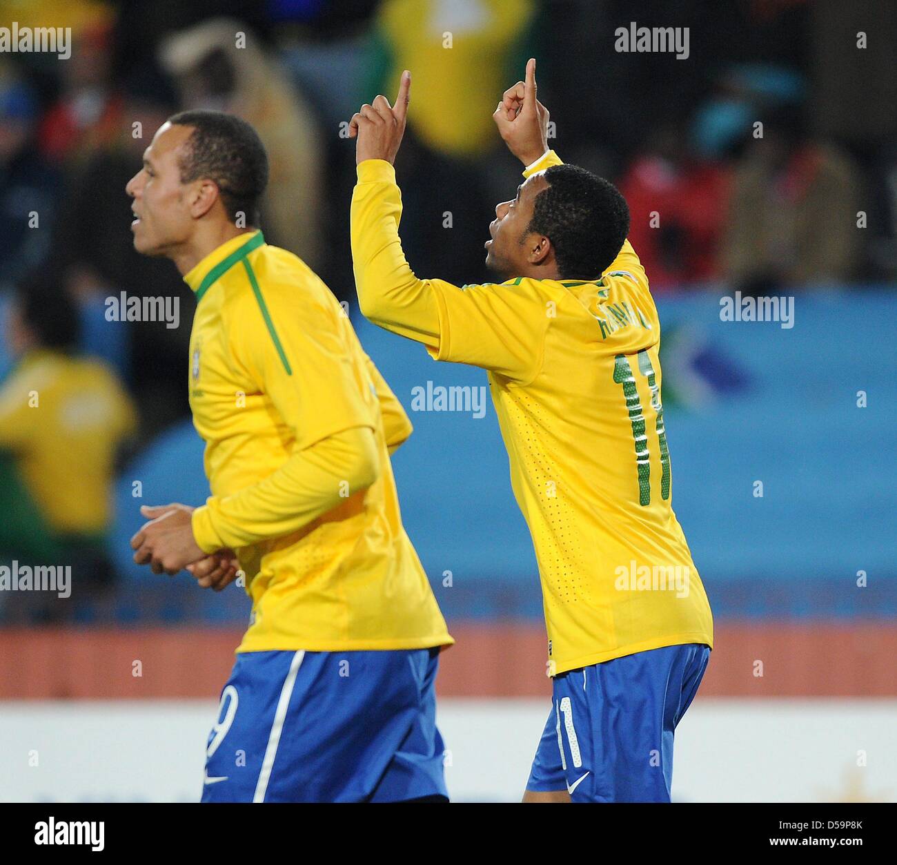 Brazil's Robinho (R) celebrates scoring the 3-0 next to team mate Luis ...