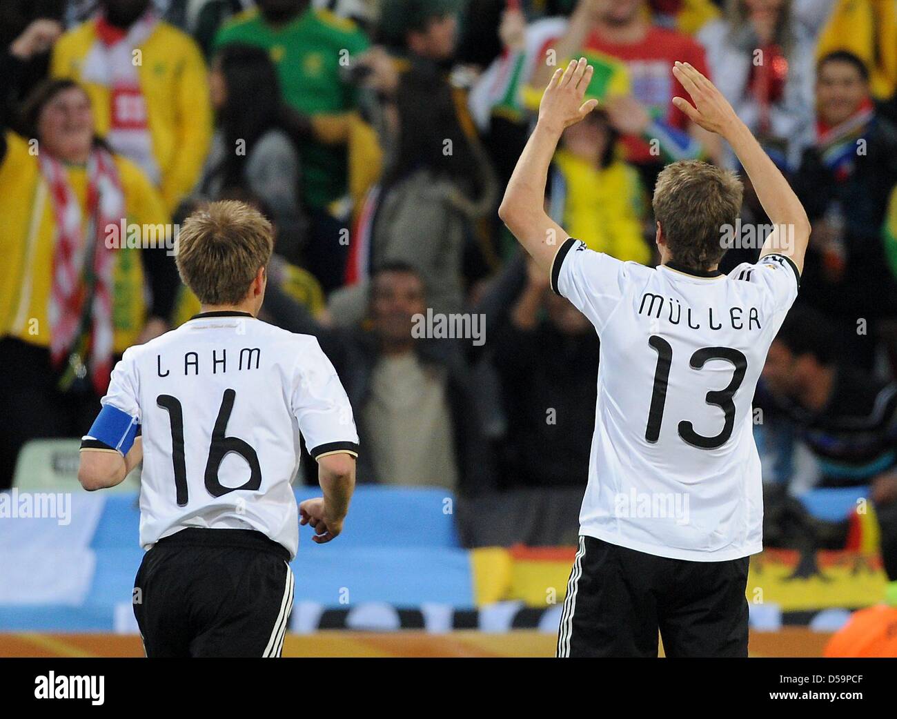 Germany's Thomas Mueller celebrates scoring with team mate Philipp Lahm ...