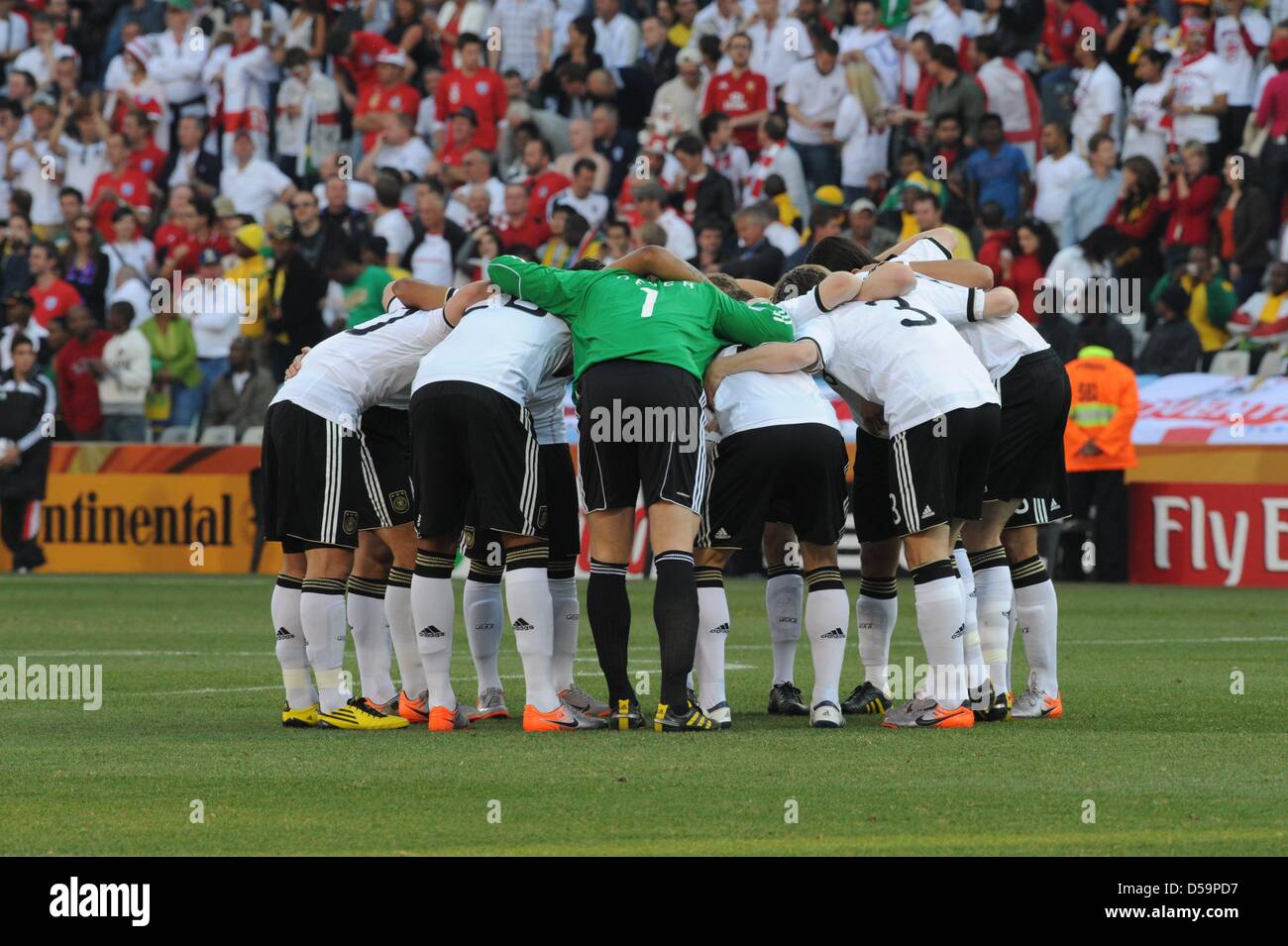 The German team stands in a circle prior to the 2010 FIFA World Cup ...