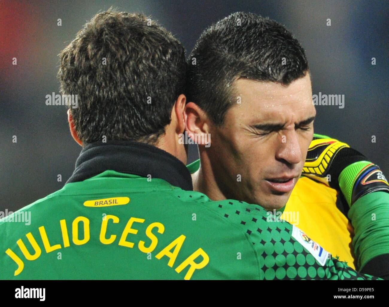Goalkeeper Julio Cesar (L) and Lucio of Brazil celebrate after the ...