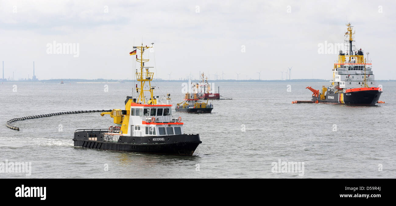The multi-purpose vessel 'Mellum' (r) participates with the oil ...