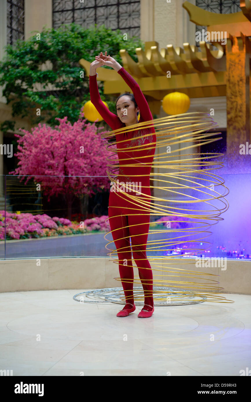 Hula hoop dancer performing at the Conrad Hotel in Macau. One of the ...