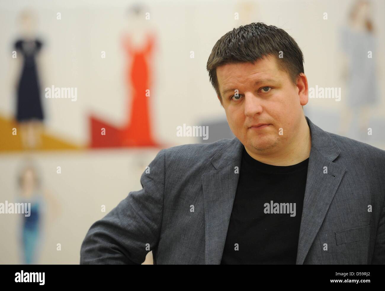 Polish painter Marcin Maciejowski smiles in front of his series 'VIP ...