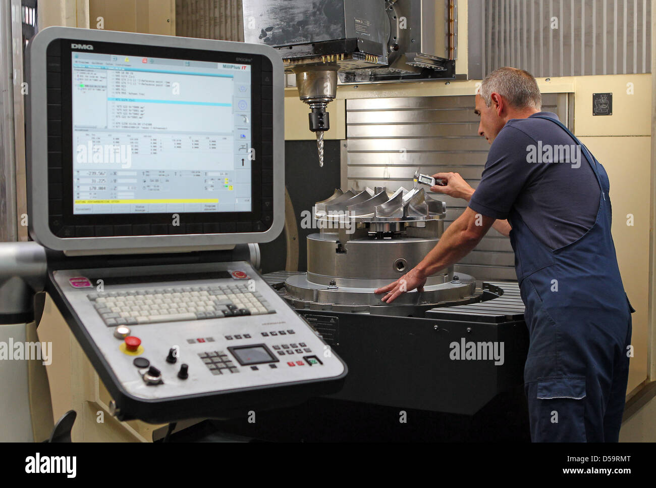Mechatronic engineer Uew Roth checks a green for a compressor in a 5 ...