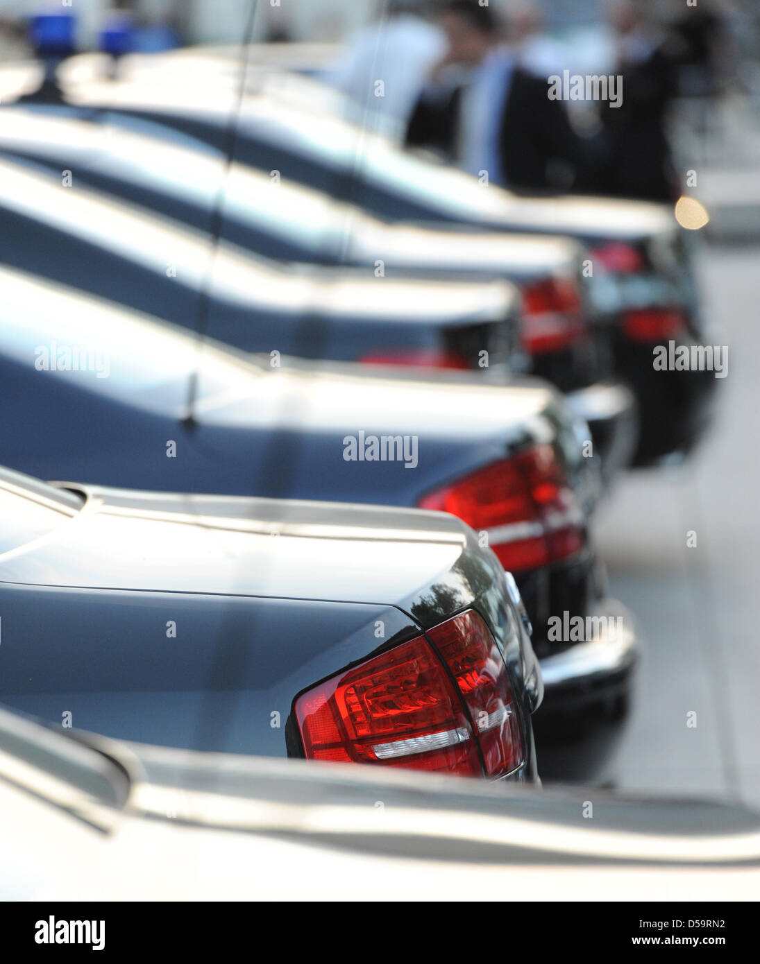 Numerous official cars are parked behind the eastern entrance of the ...
