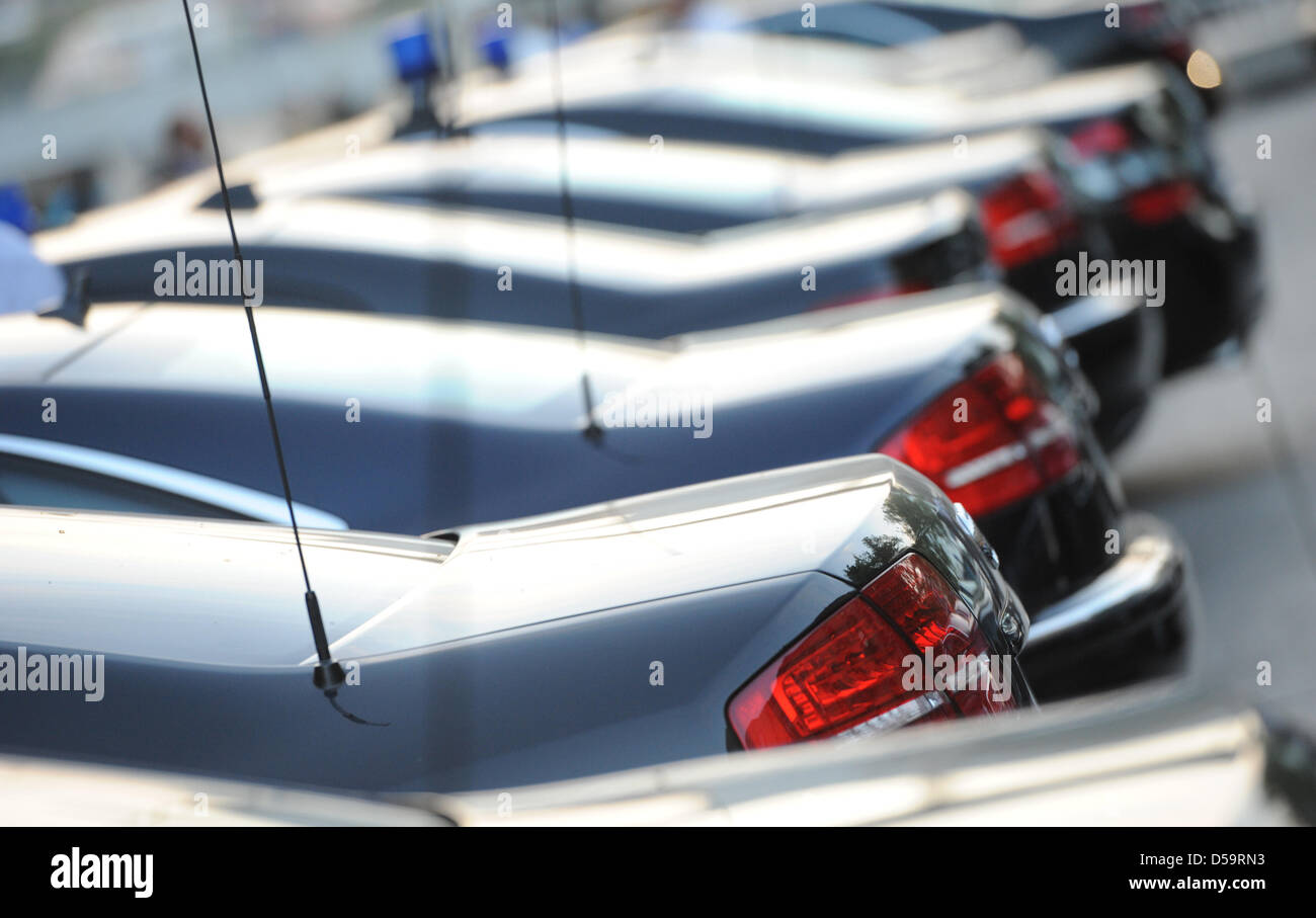 Numerous official cars are parked behind the eastern entrance of the ...
