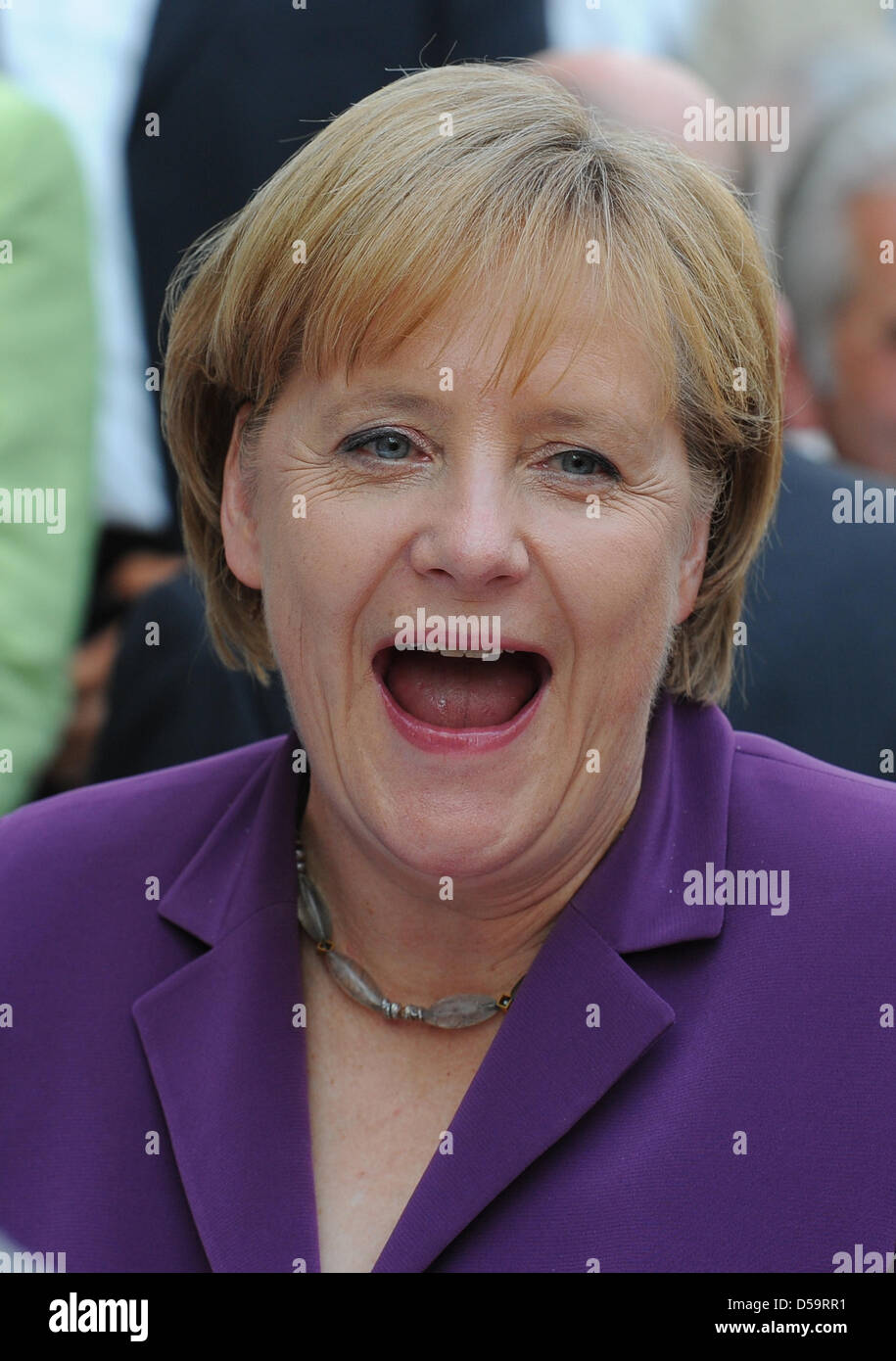 German Chancellor Angela Merkel laughs during the traditional ...