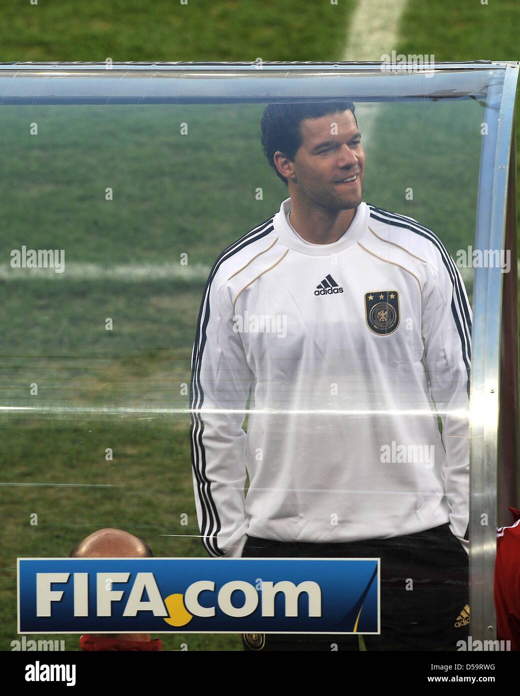 Injured German soccer player Michael Ballack visits the team during a ...