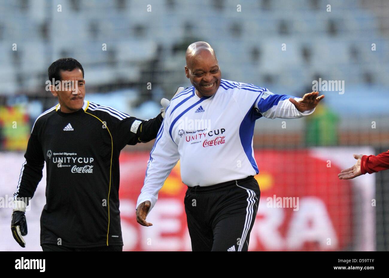 South African President Jacob Zuma (C) takes part in an All-Star soccer ...