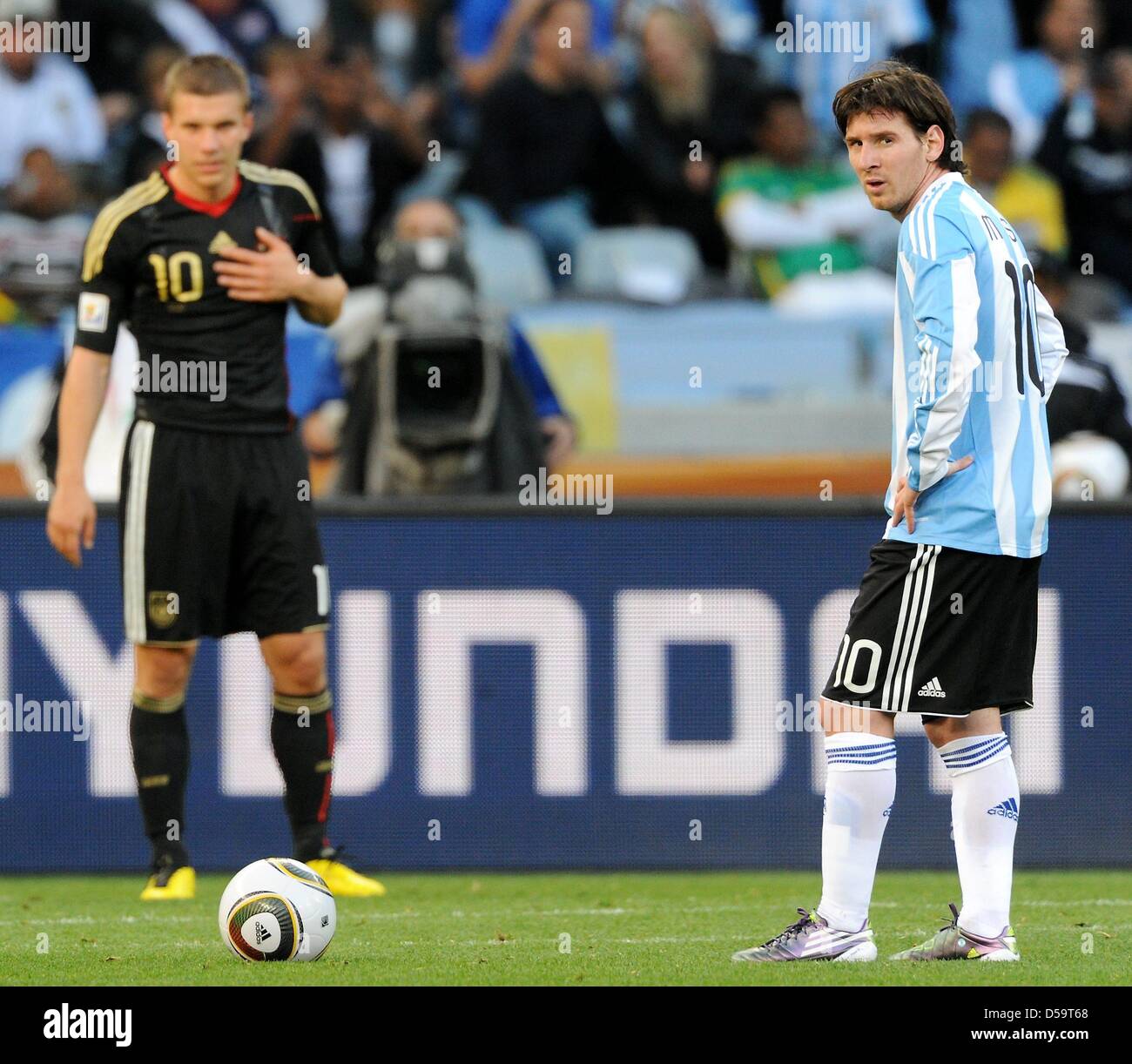 Argentina's Lionel Messi (R) waits for a freekick watched by Germany's ...