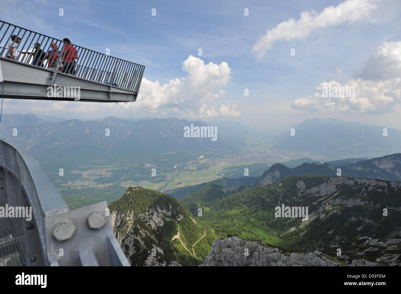 Workers stand on lookout platform 'AlpspiX' on Alpspitze mountain near ...