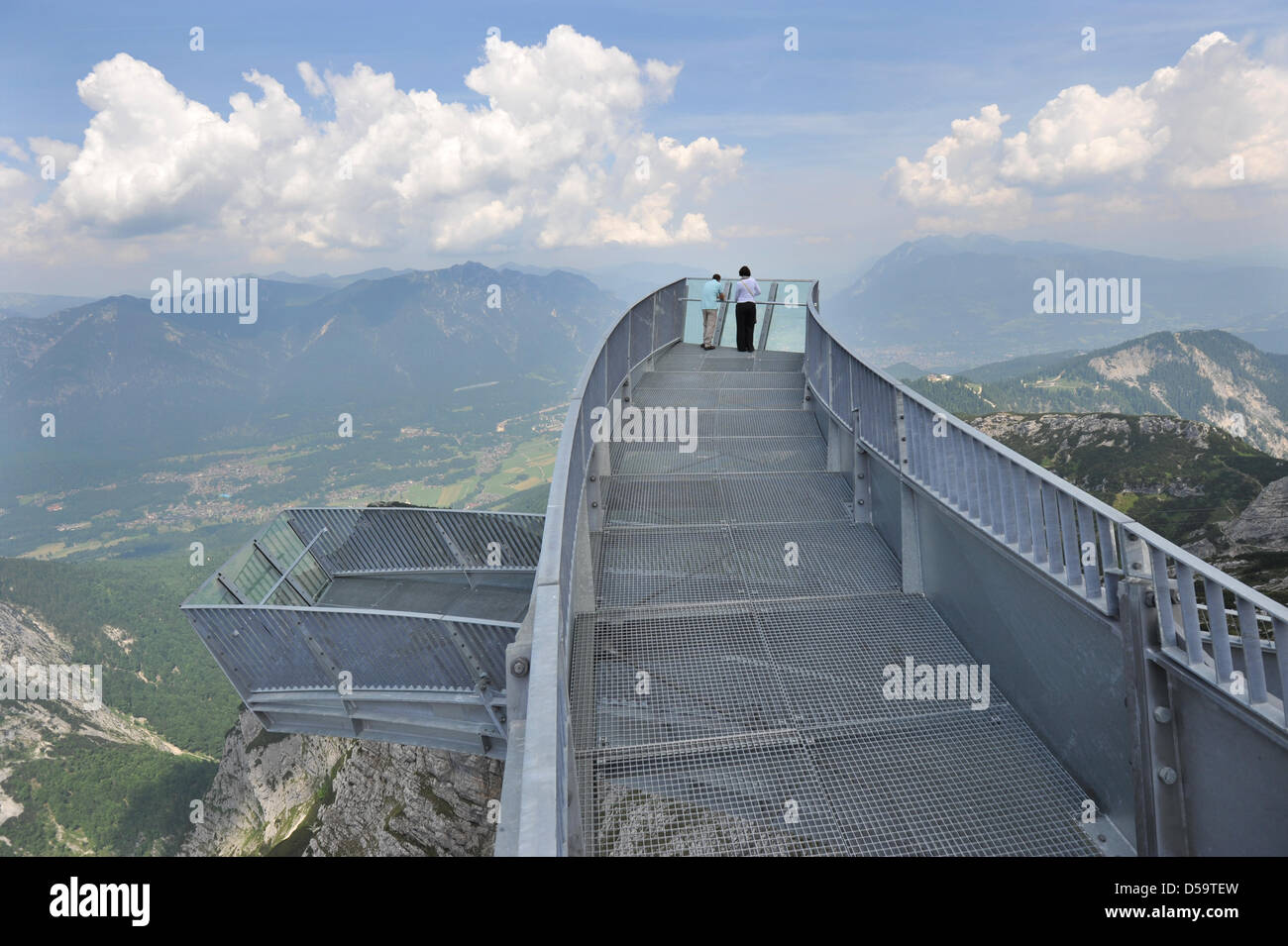 Workers stand on lookout platform 'AlpspiX' on Alpspitze mountain near ...