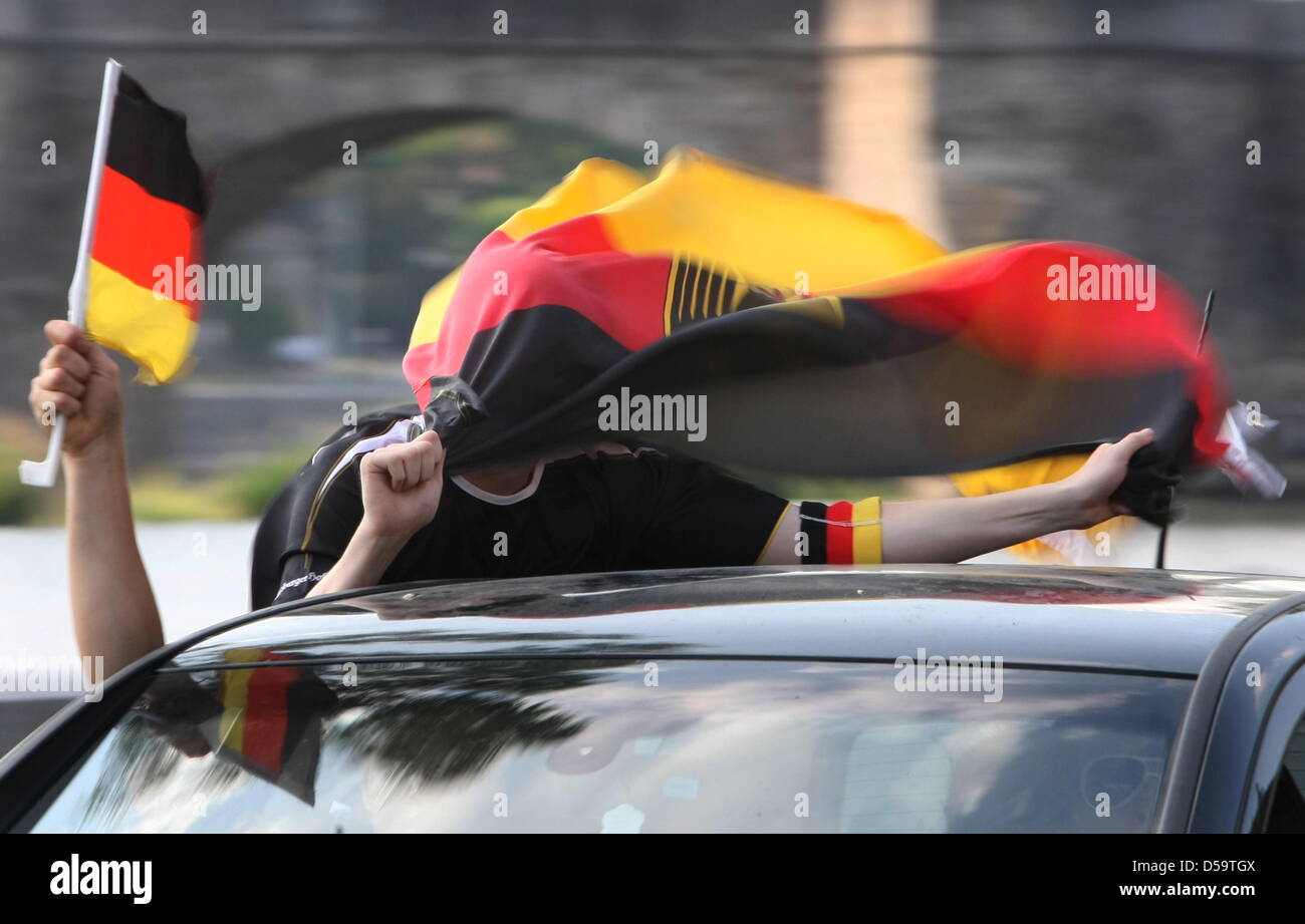Soccer fans celebrate the victory of the German national soccer-team ...