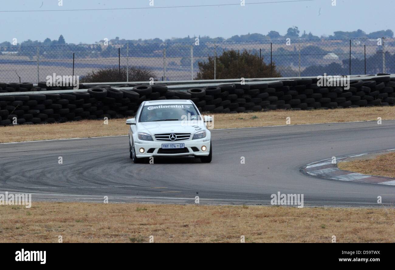 German players drive a car on the Zwartkops race track during a ...