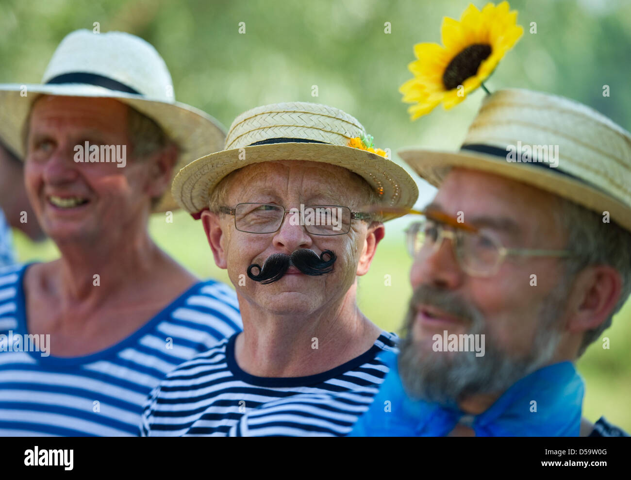 Three men in historical bathing suits at the German-Polish border river ...