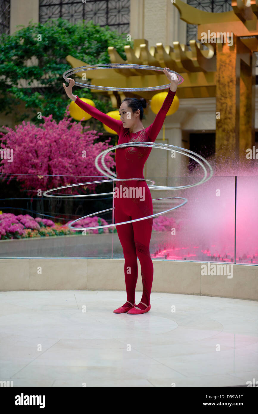 Hula hoop dancer performing at the Conrad Hotel in Macau. One of the ...