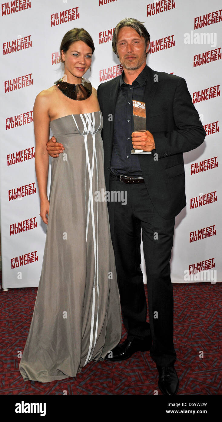 Danish actor Mads Mikkelsen with his CineMerit Award and German actress ...