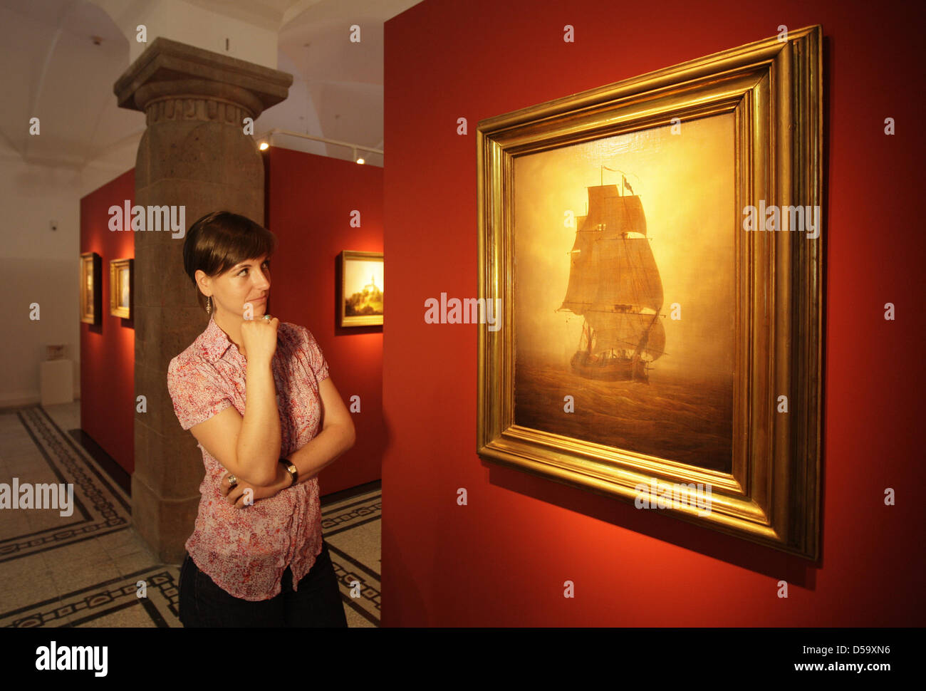 A woman eyes the painting 'Sailing Ship in the Fog' (around 1815) by ...