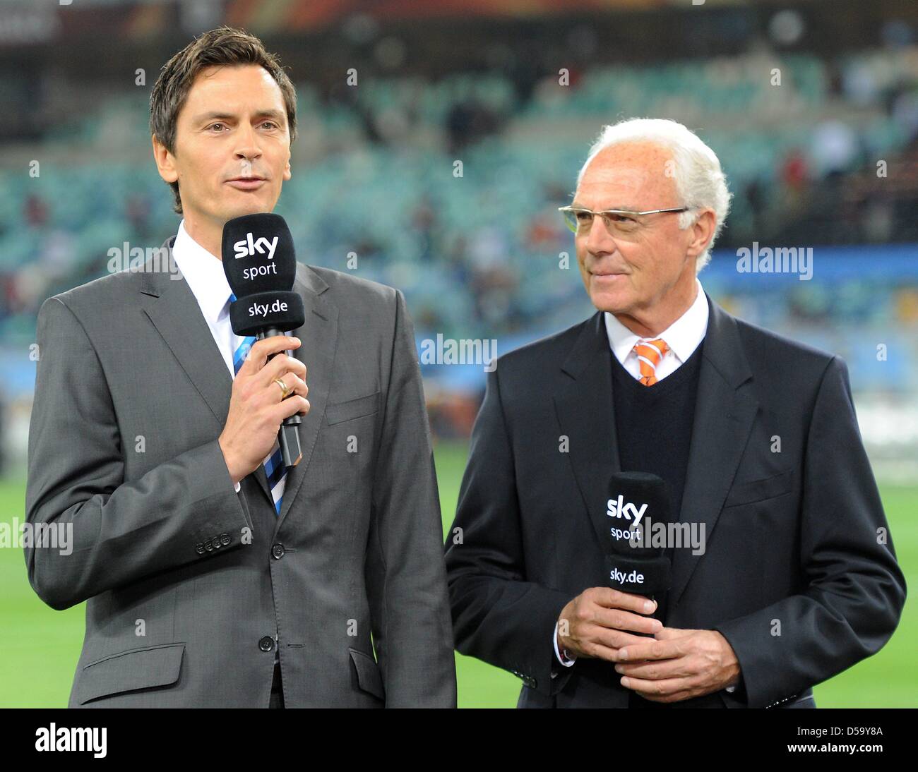 Former German soccer player Franz Beckenbauer (R) during an interview ...