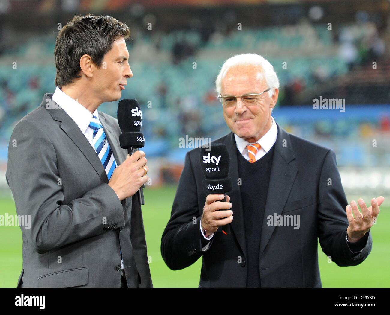 Former German soccer player Franz Beckenbauer (R) during an interview ...