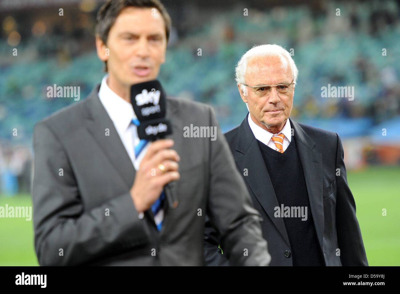 Former German soccer player Franz Beckenbauer (R) during an interview ...