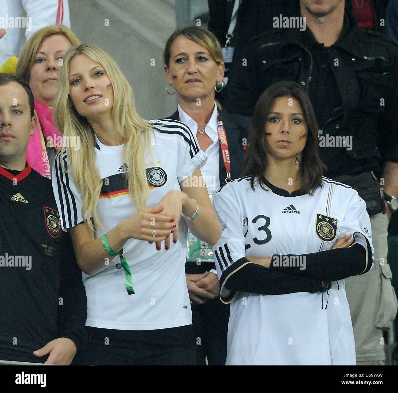 Daniela Loew (2nd L, partly hidden), the wife of German headcoach ...