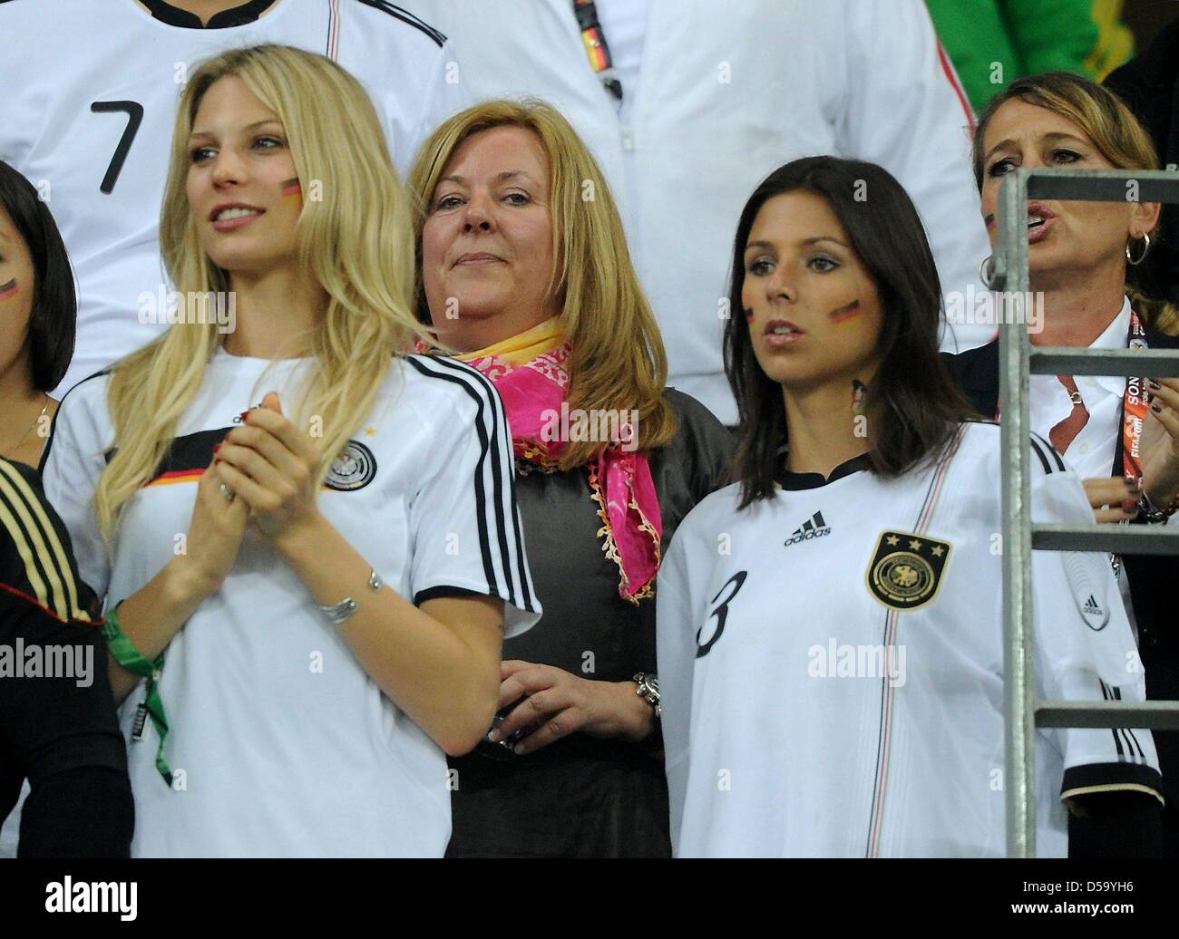 Daniela Loew (C), the wife of German headcoach Joachim Loew, Sarah ...
