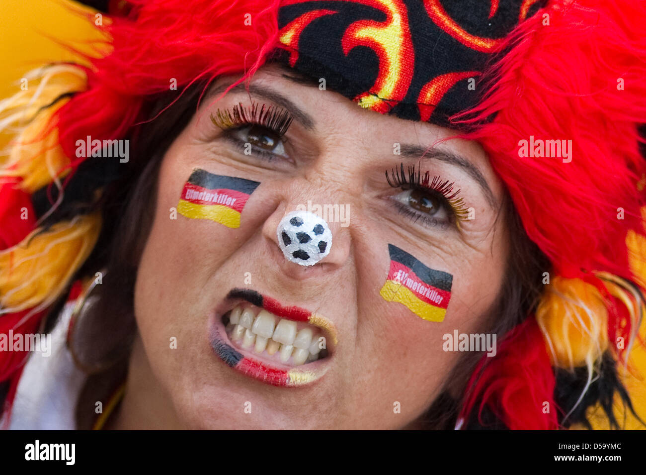 A soccer fans watches the German national team play the semi final at ...