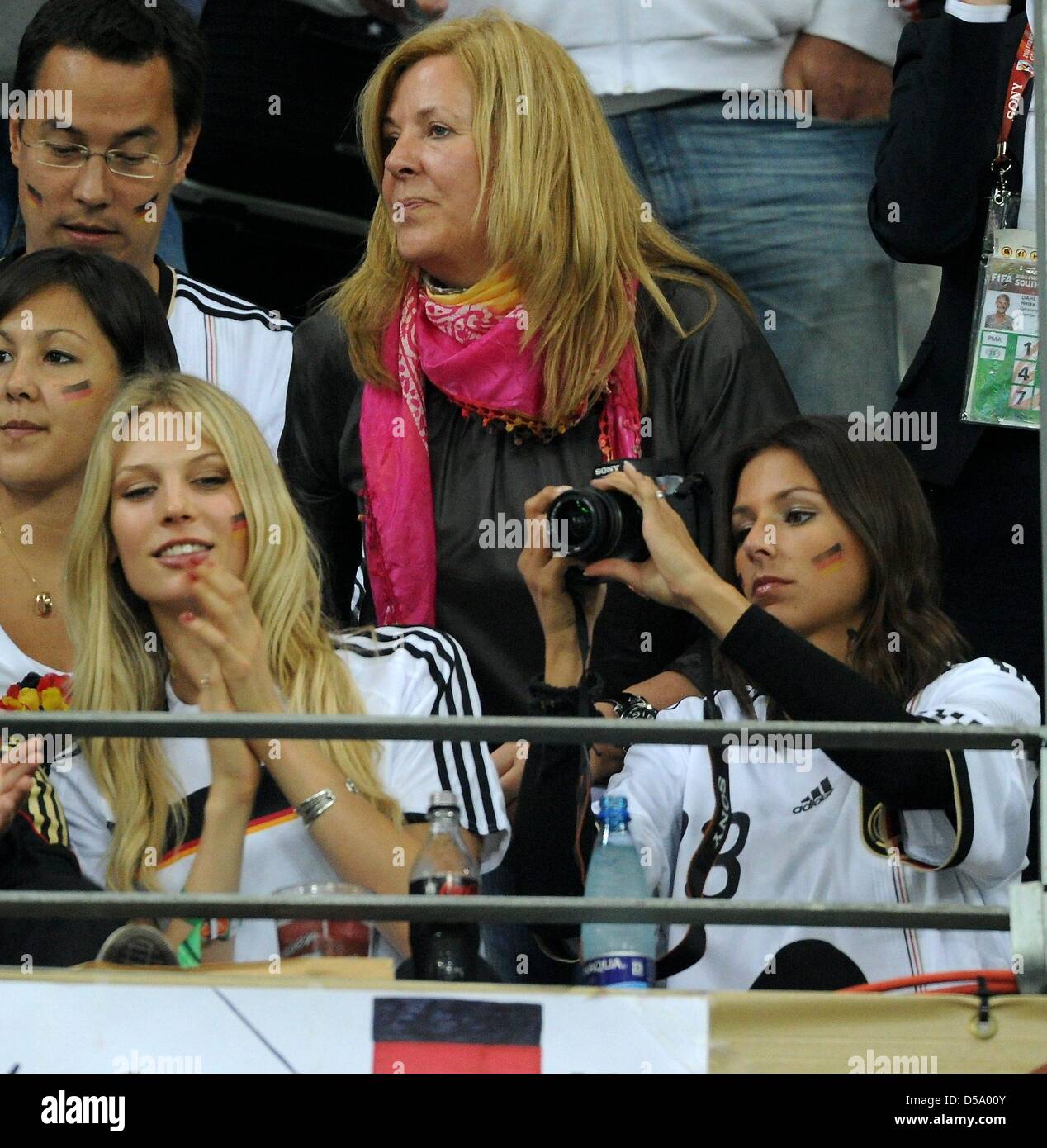 Daniela Loew (C with pink scarf), the wife of German headcoach Joachim ...