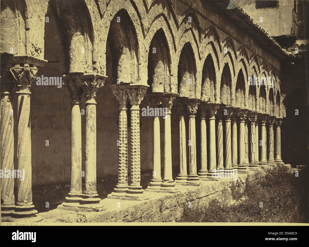 This image showcases the cloister arcades and capitals of the Monreale ...