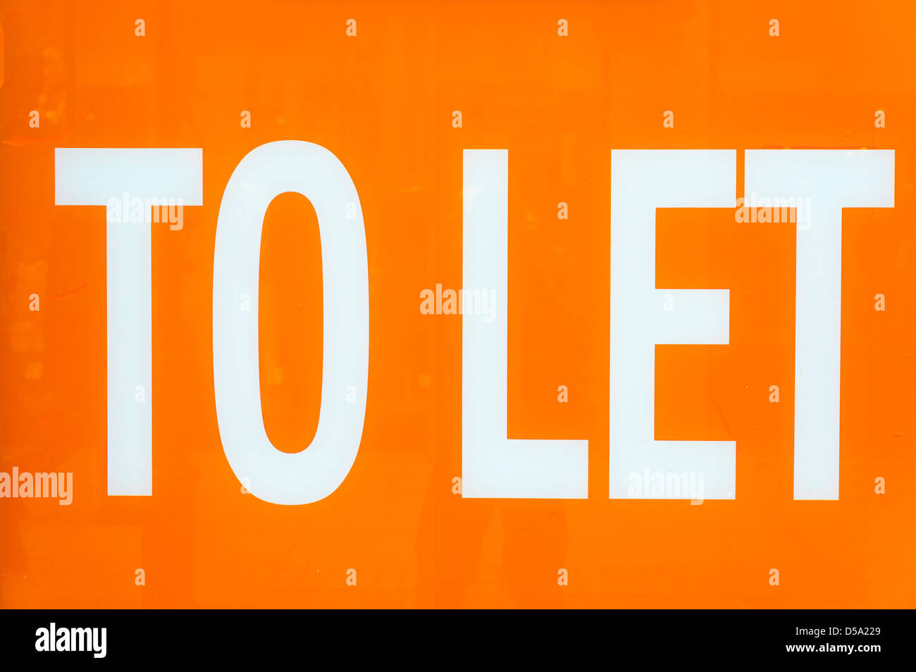 To let sign orange with white letters Stock Photo - Alamy