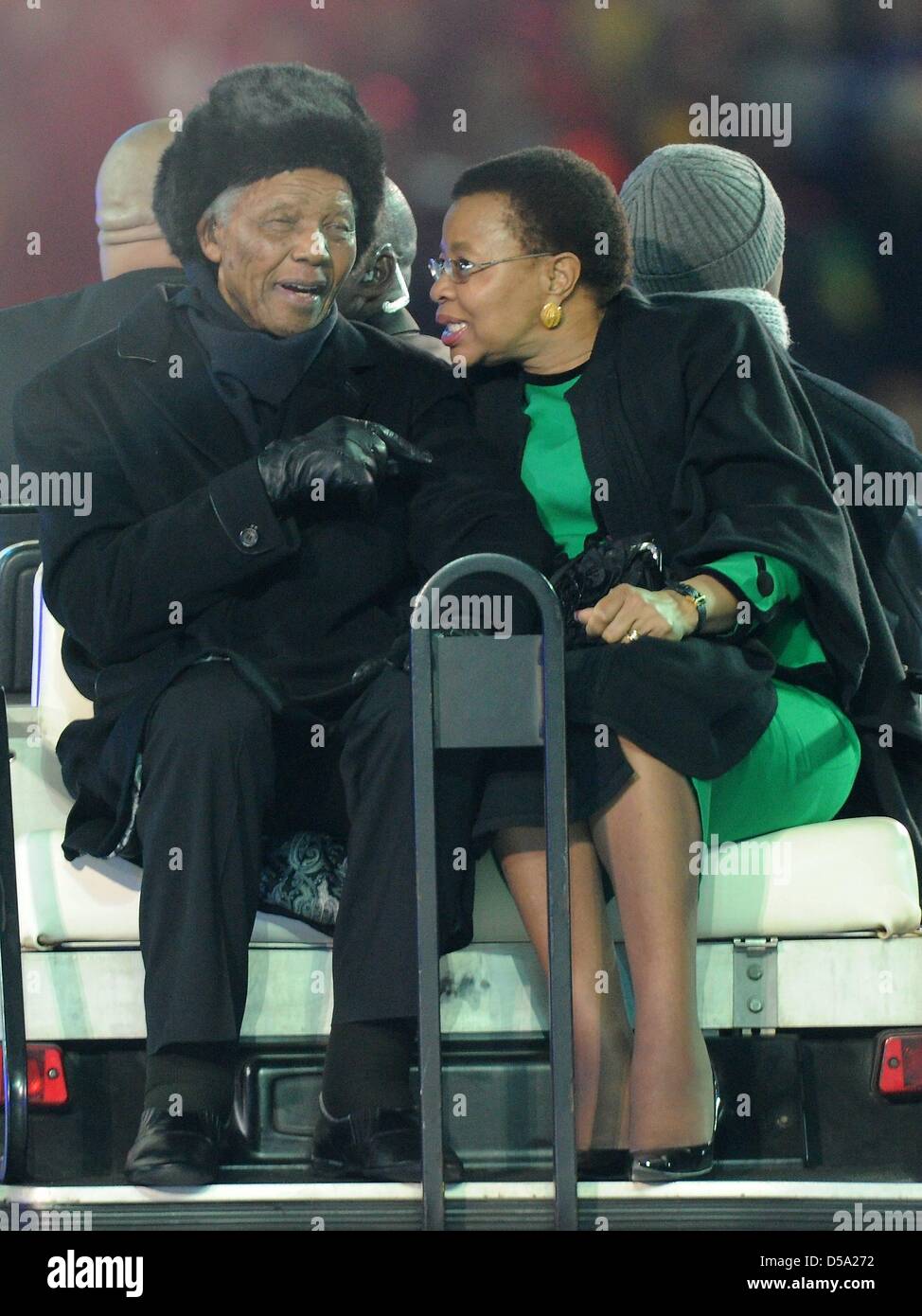 Former South African President Nelson Mandela and his wife Graca Machel ...