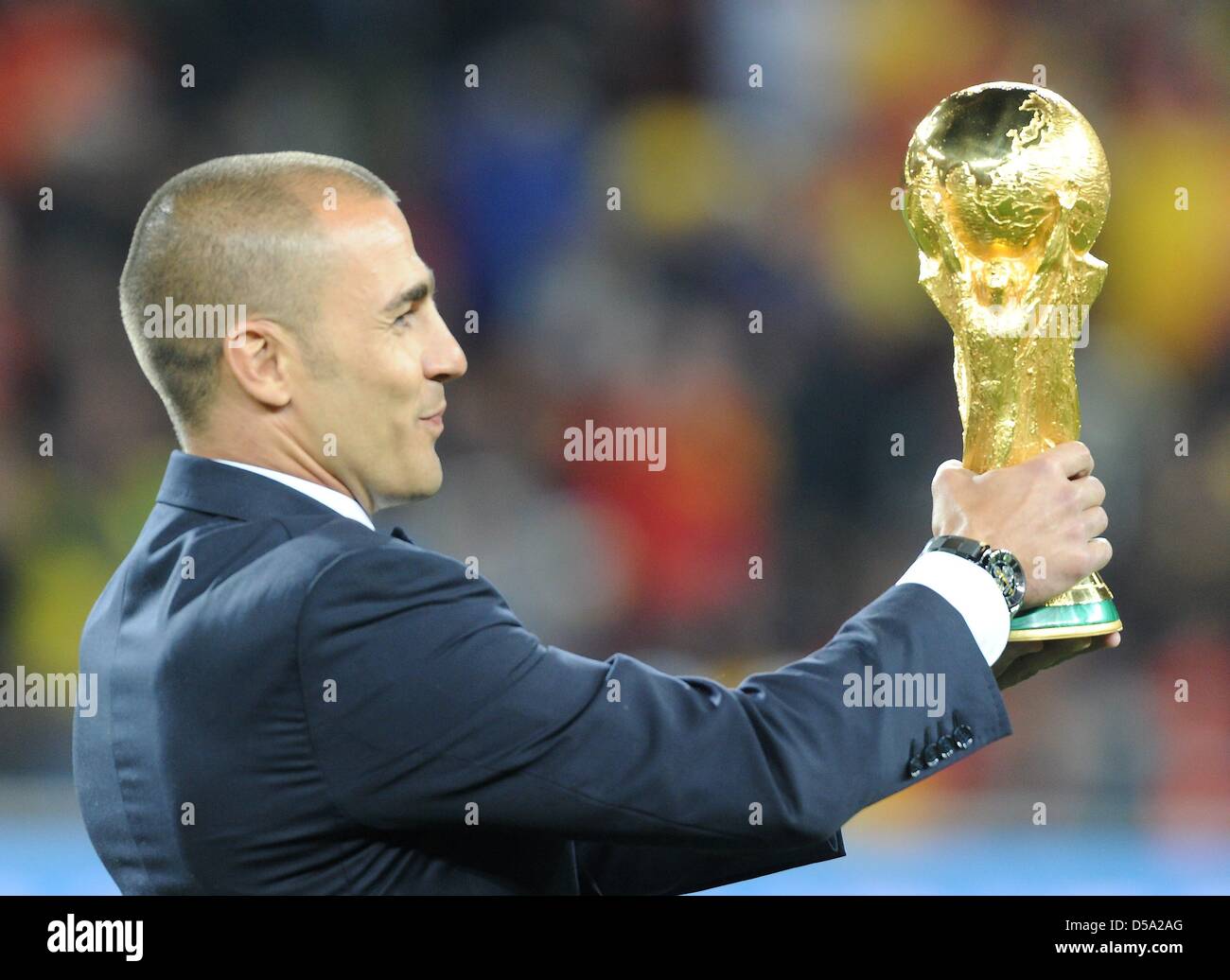 Italian team captain Fabio Cannavaro presents the World Cup trophy ...