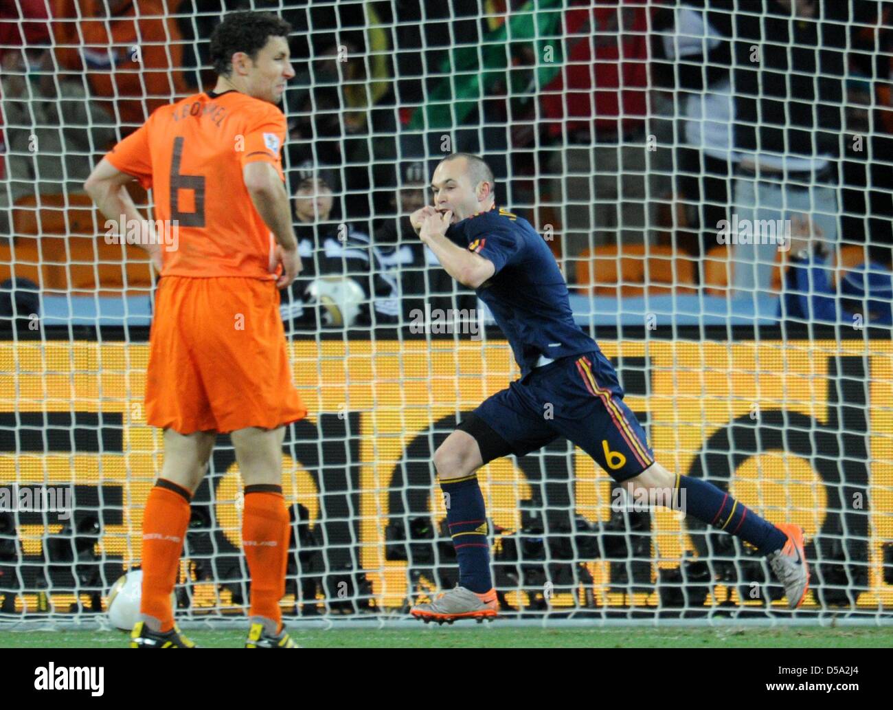 Andres Iniesta (R) of Spain celebrates after scoring the 1-0 next to ...
