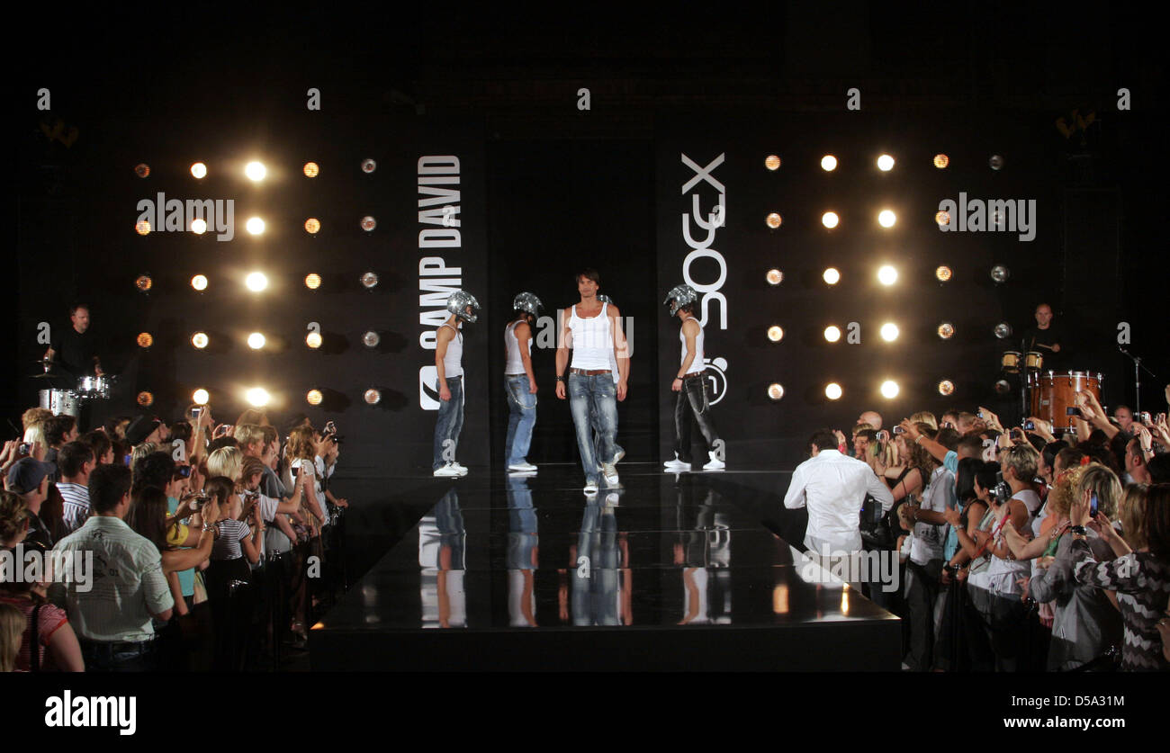 The Swedish model Marcus Schenkenberg (C) walks for the label 'Camp ...