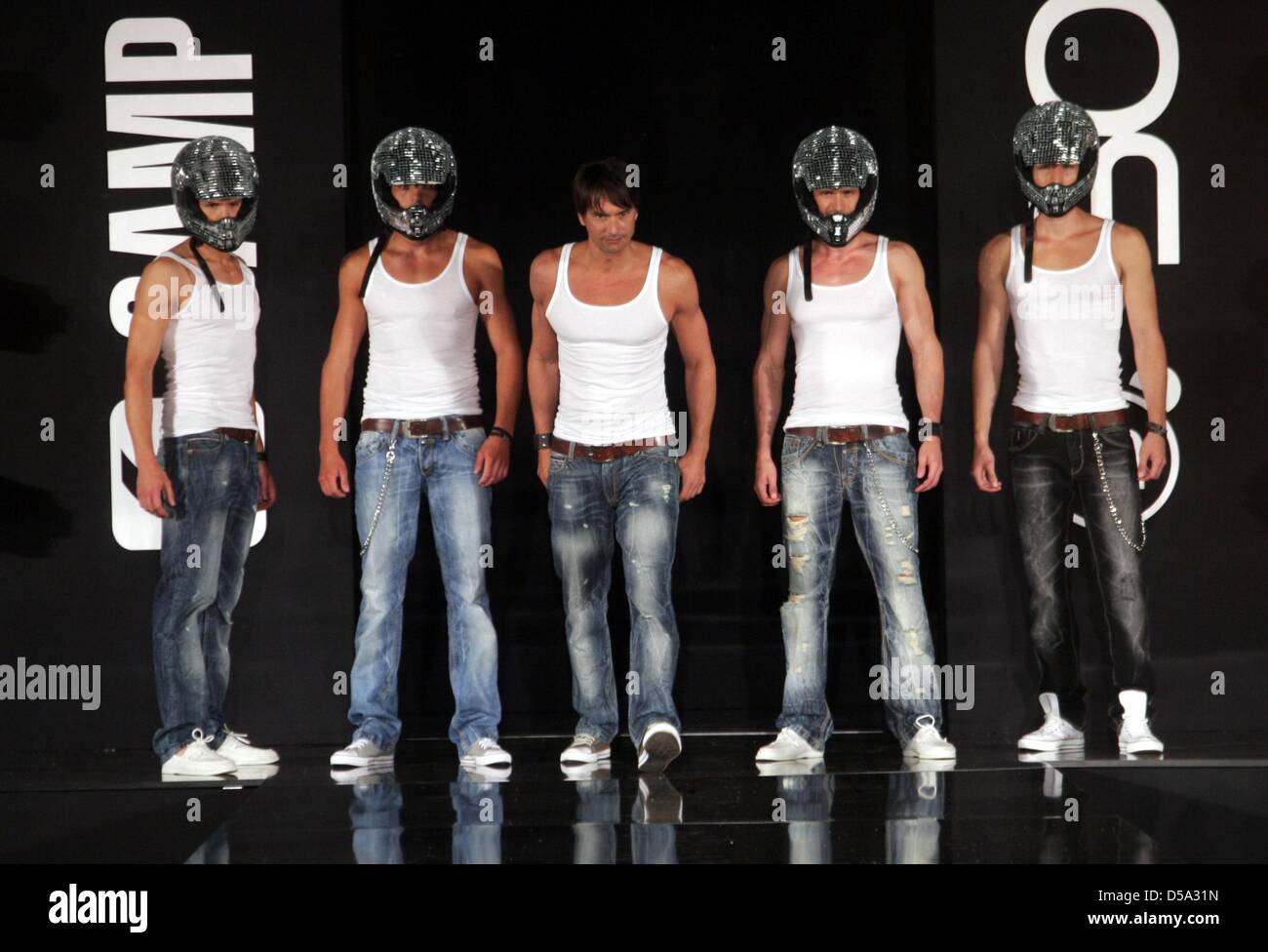 The Swedish model Marcus Schenkenberg (C) walks for the label 'Camp ...