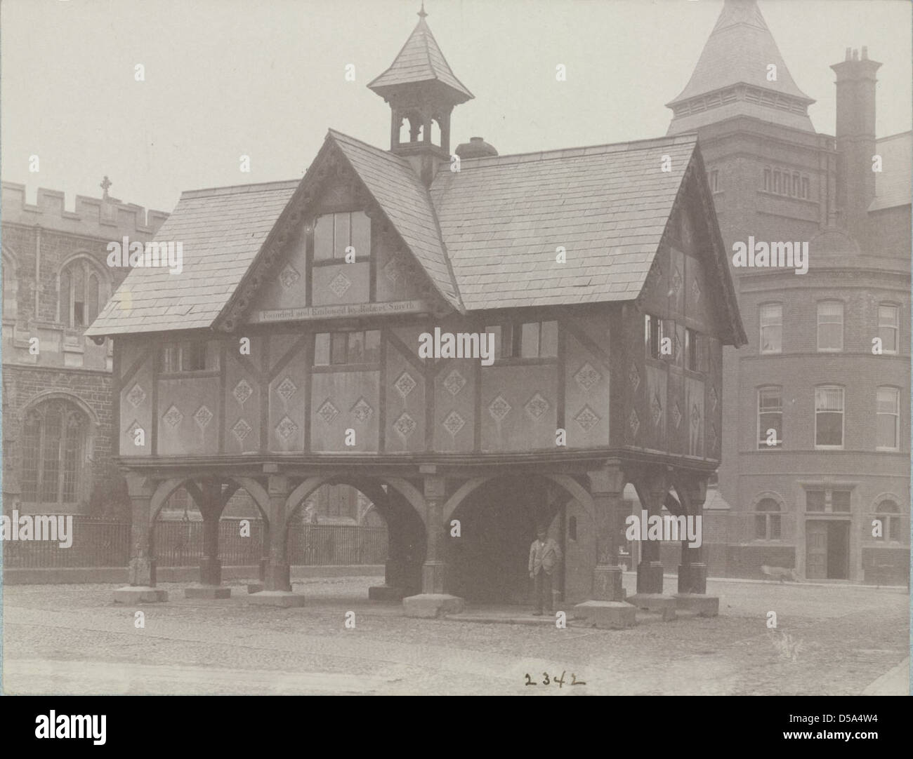 A photograph showing an English market stand, likely from the early ...