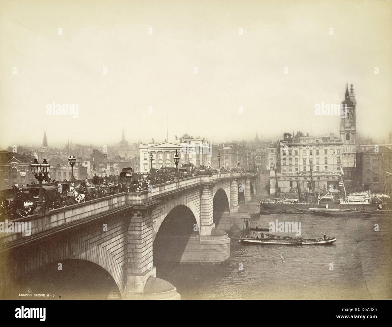 An iconic image of London Bridge featuring its arch, the surrounding ...