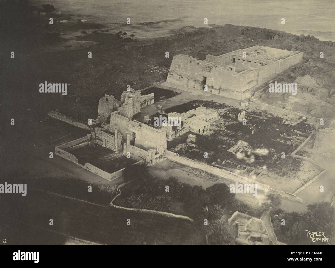 An image showing an Egyptian temple complex along the Nile River. This ...