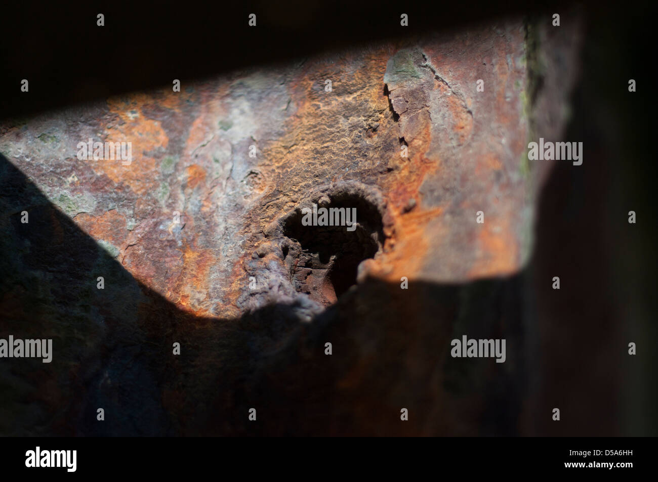 Hole in rusty metal on Shorham Beach, United Kingdom Stock Photo - Alamy