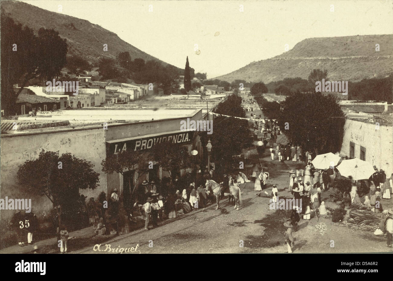 A photograph depicting a rural scene in Mexico, showing laundry lines ...