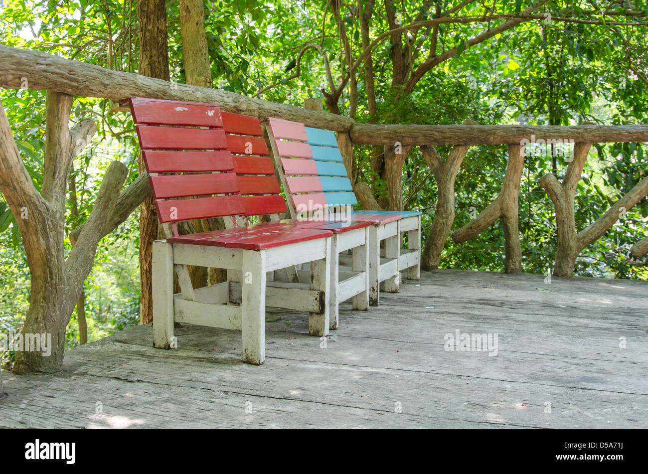 Chairs made of wood put together a variety of colors Stock Photo - Alamy