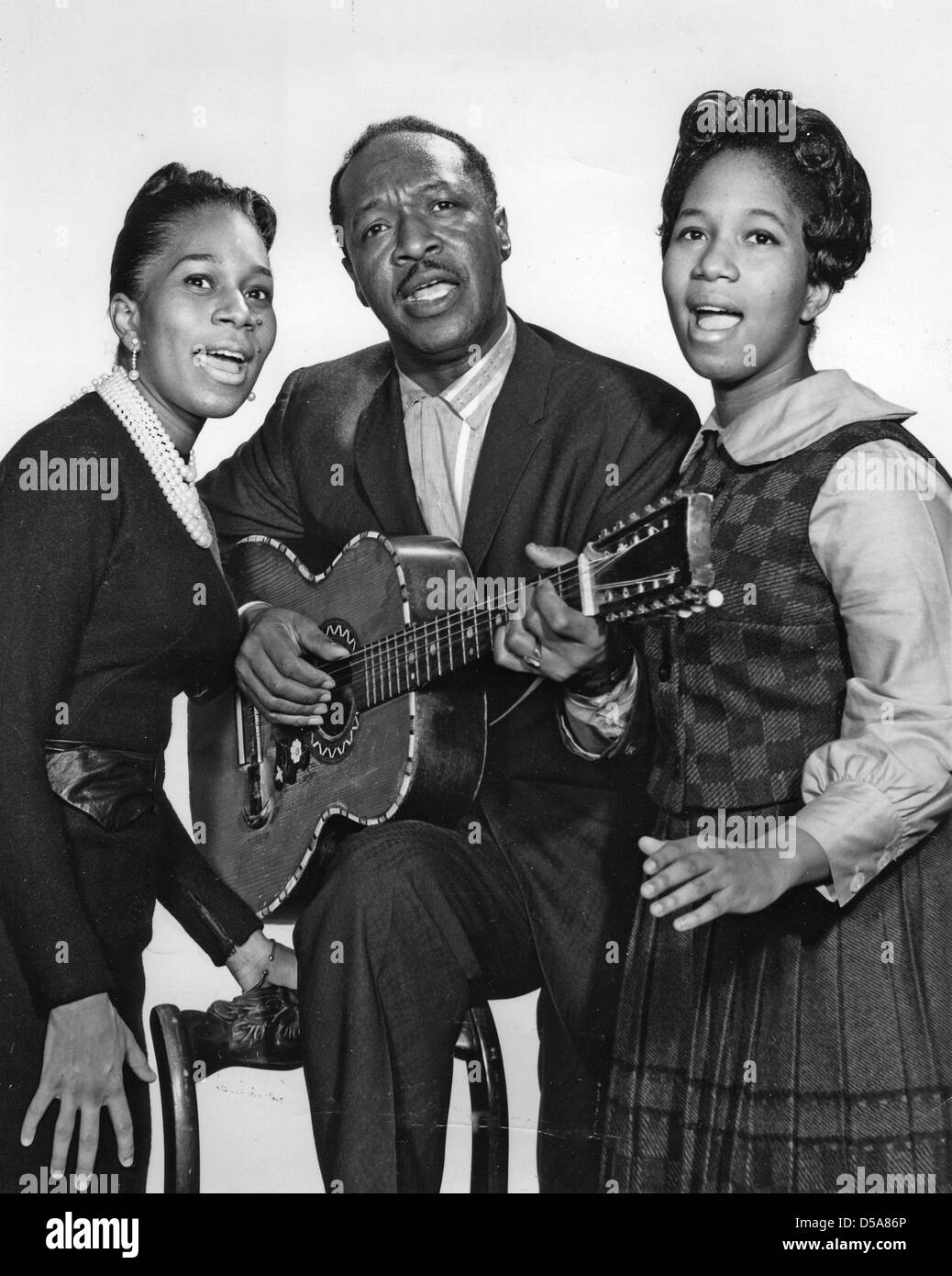JOSH WHITE (1914-1969) US singer with daughters Beverly at left and ...