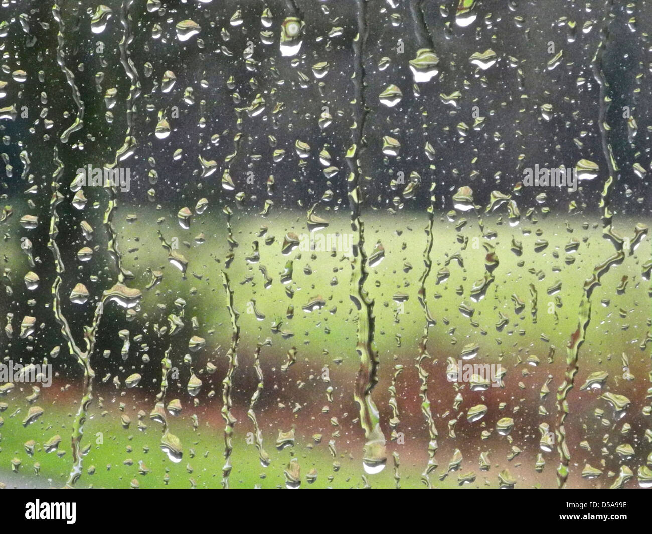 Raindrops rain drops rain on a window Stock Photo - Alamy