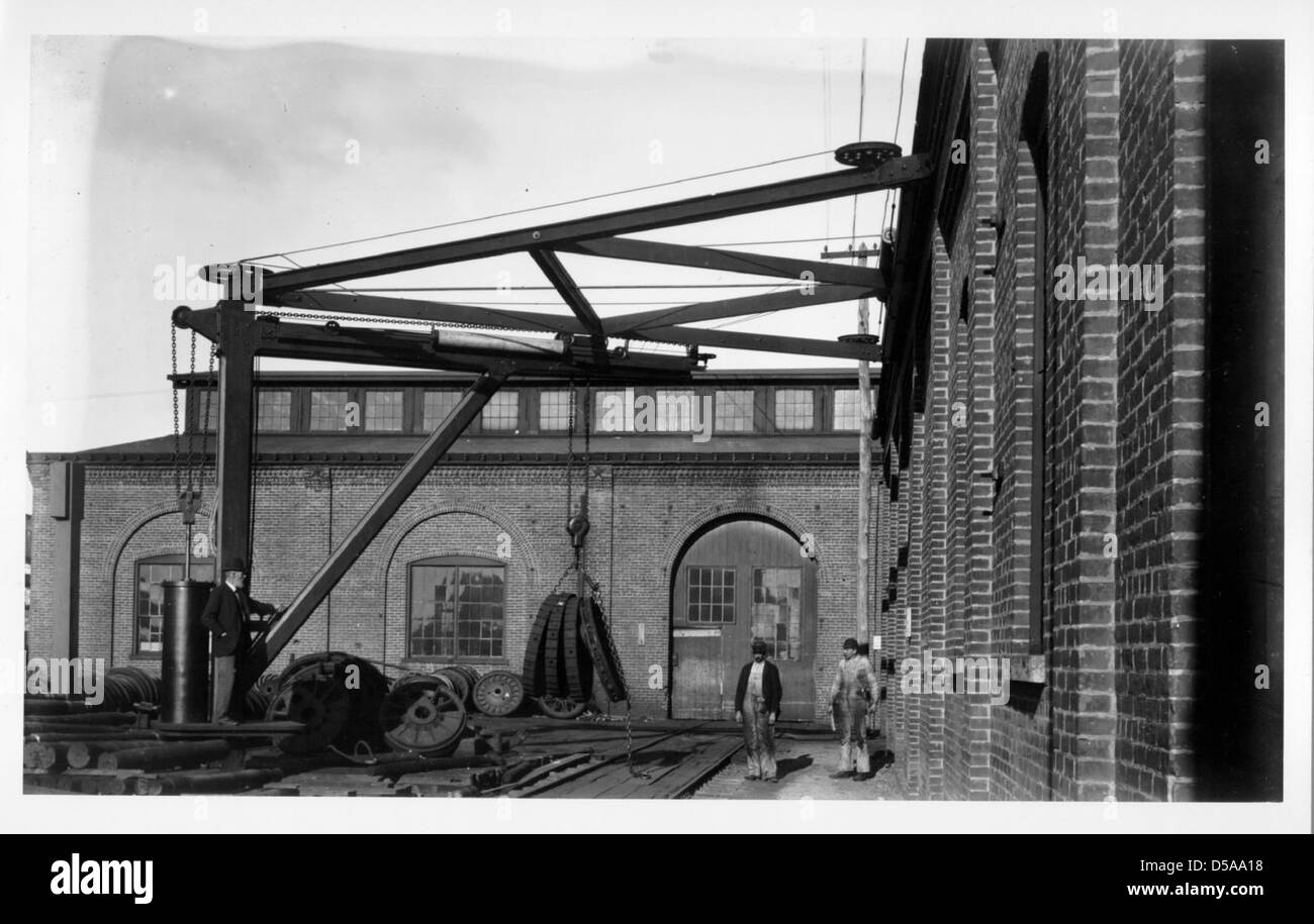 A historical photograph of a repair shop in New York State, with two ...
